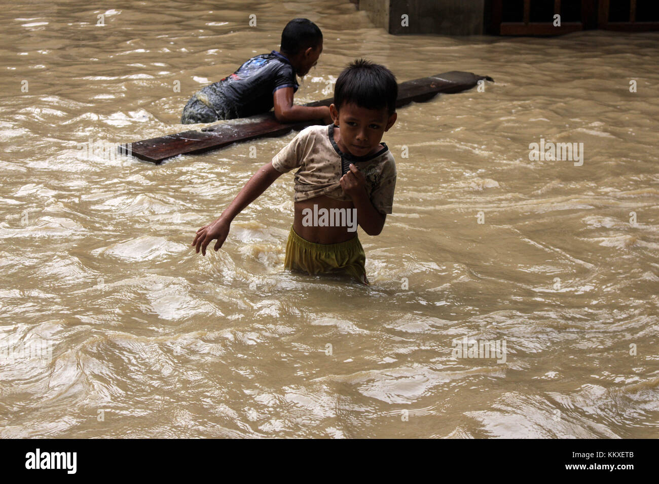 Children playing in flood water hi-res stock photography and images - Alamy
