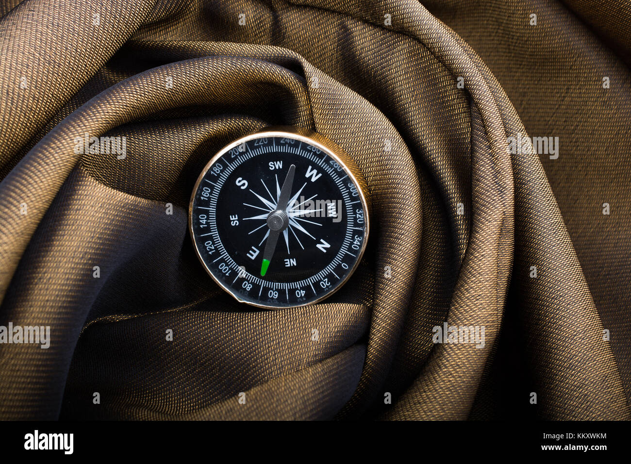 Black color compass instrument on fabric canvas Stock Photo - Alamy