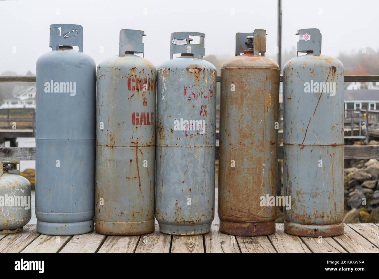 Propane Tanks on Dock with rust and signs of wear Stock Photo - Alamy
