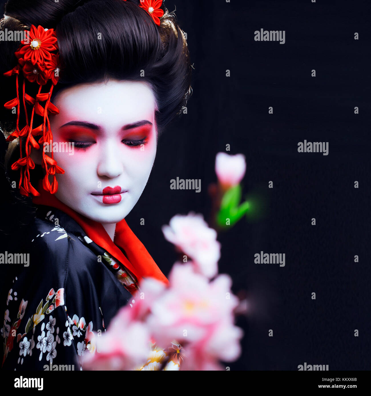 young pretty geisha in kimono with sakura and decoration Stock Photo ...