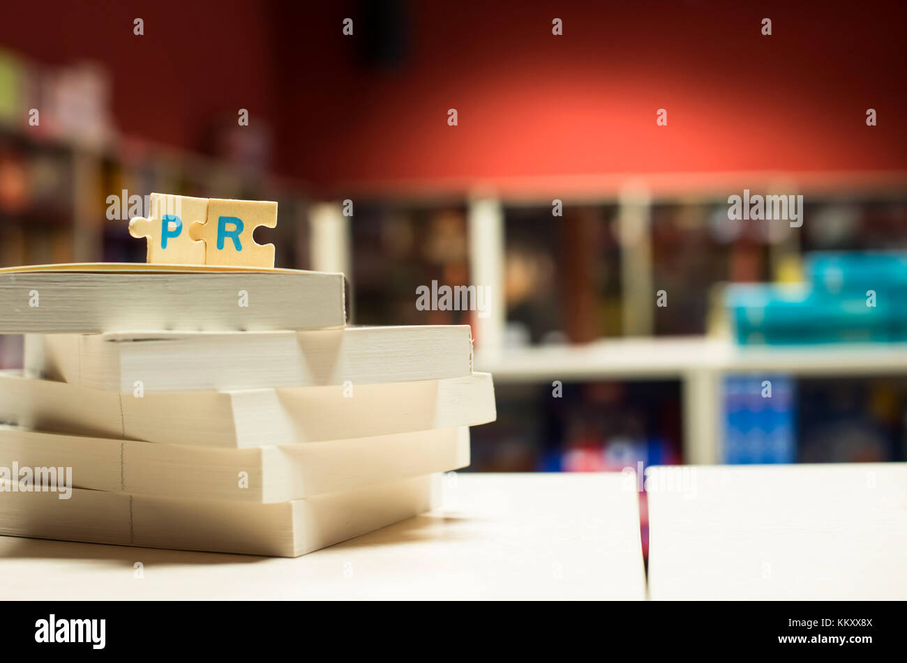 PR puzzle letters. Word PR over books in bookstore Stock Photo - Alamy