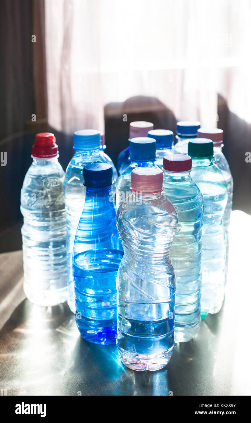 Plastic bottles with mineral water on a table Stock Photo - Alamy