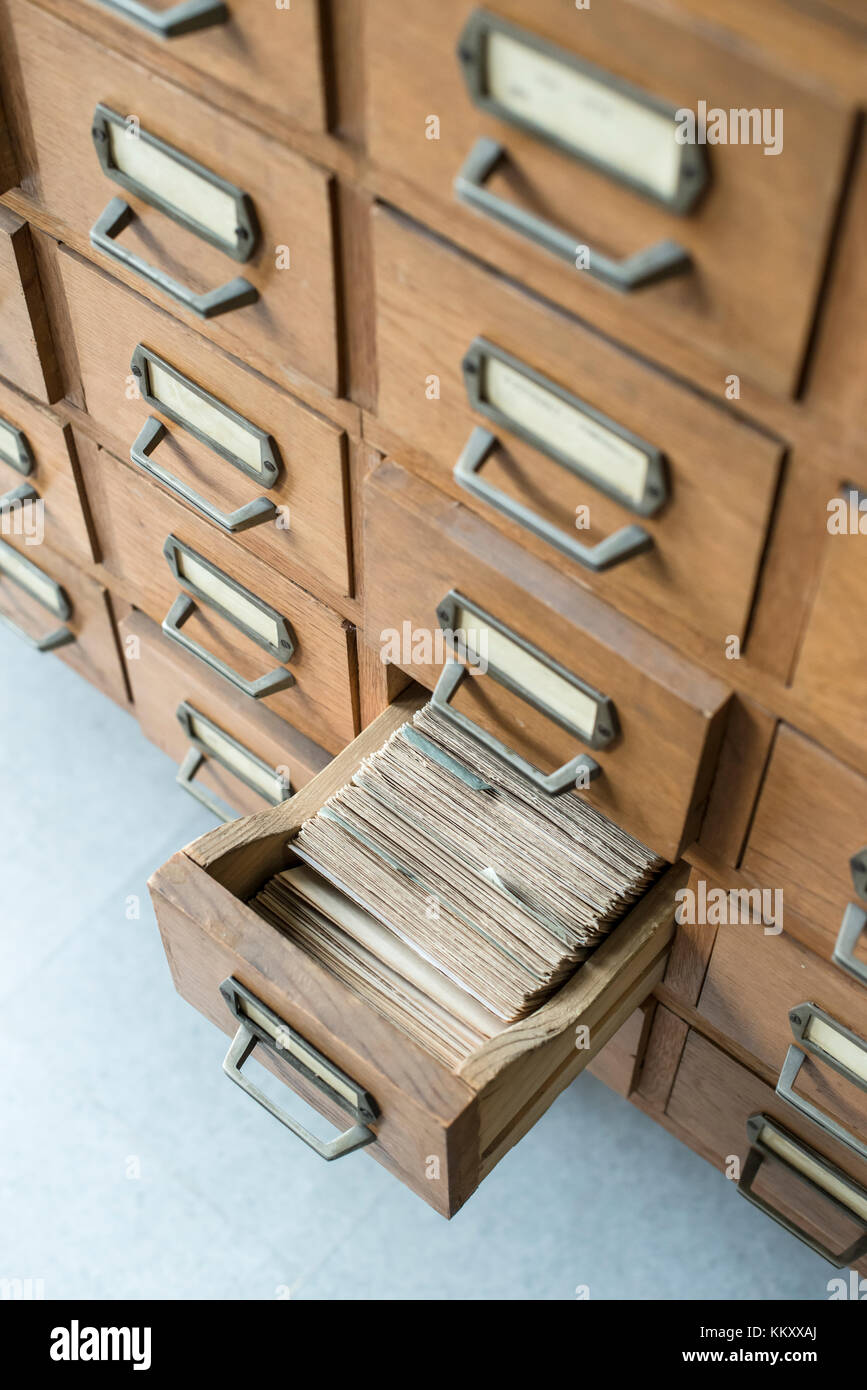 Old opened wooden drawers in archive Stock Photo - Alamy