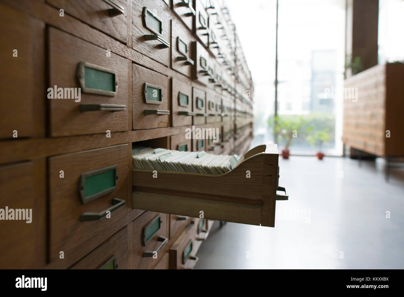 Old opened wooden drawers in archive Stock Photo - Alamy