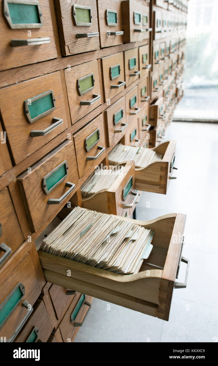Old opened wooden drawers in archive Stock Photo - Alamy