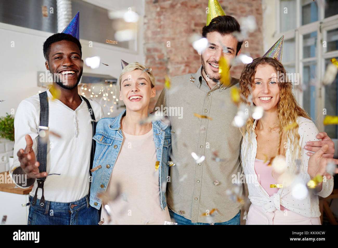 Young affectionate friends in birthday caps having fun at party Stock ...