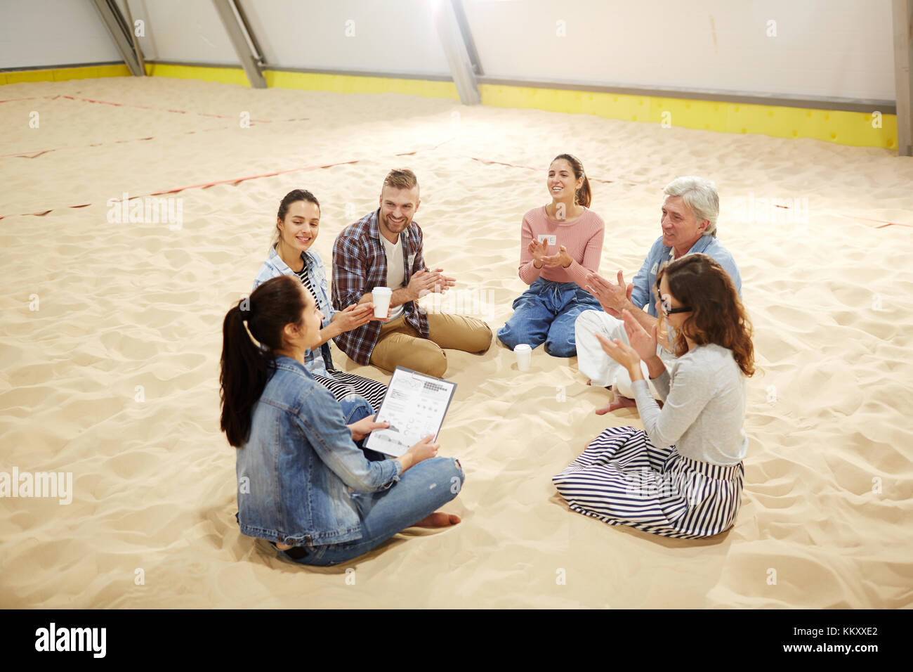 Group of sports motivation session applauding to one of their ...