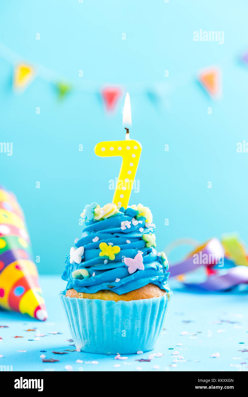 Seventh 7th birthday cupcake with candle and sprinkles. Card mockup ...