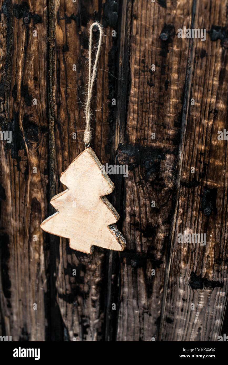 Fir shape on dark wooden background Stock Photo - Alamy