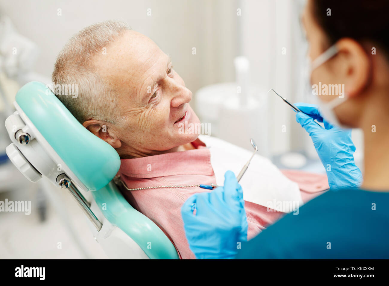 Aged man complaining about problems with teeth before dental check-up ...