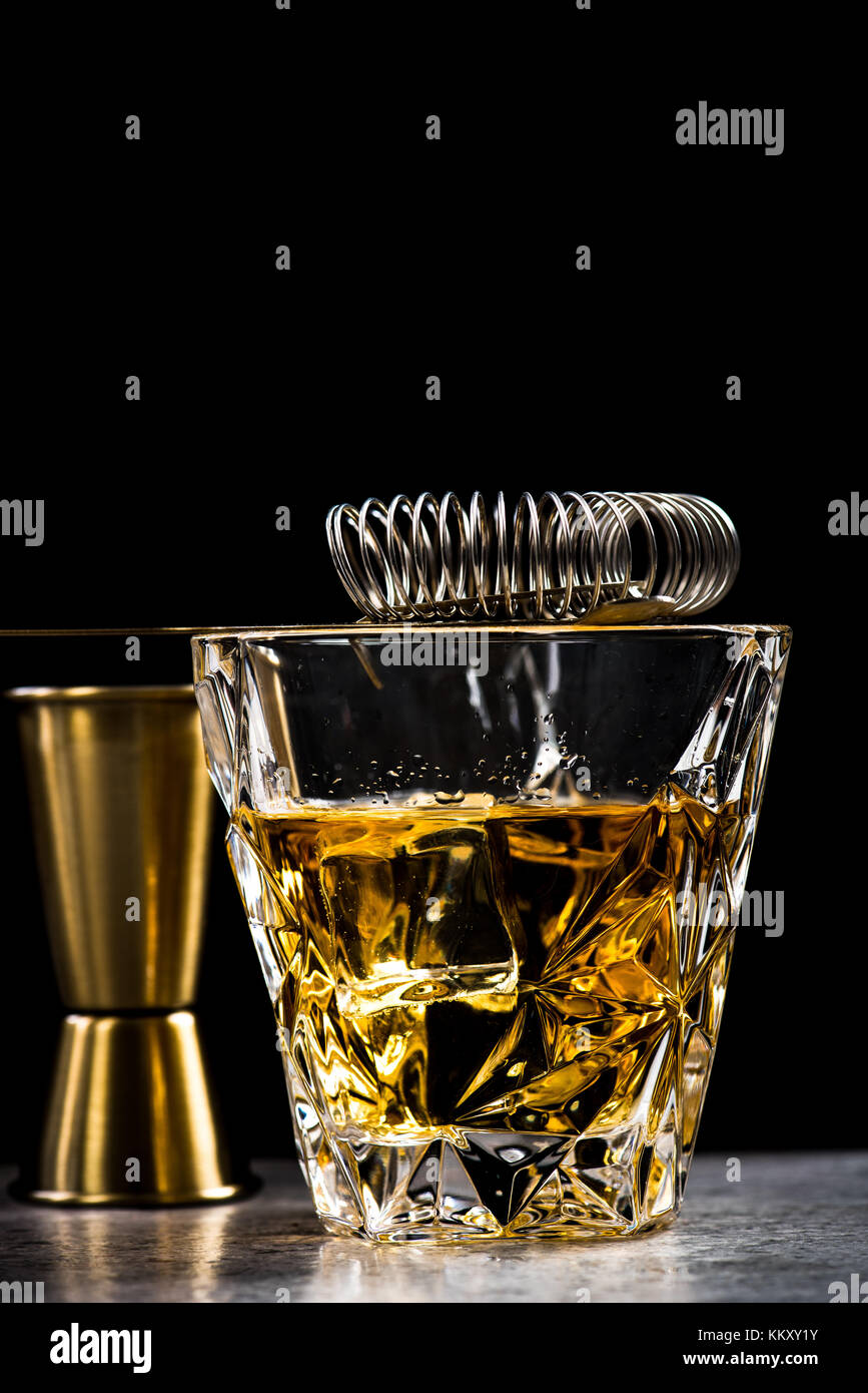 Glass with alcohol and barista equipement Stock Photo - Alamy