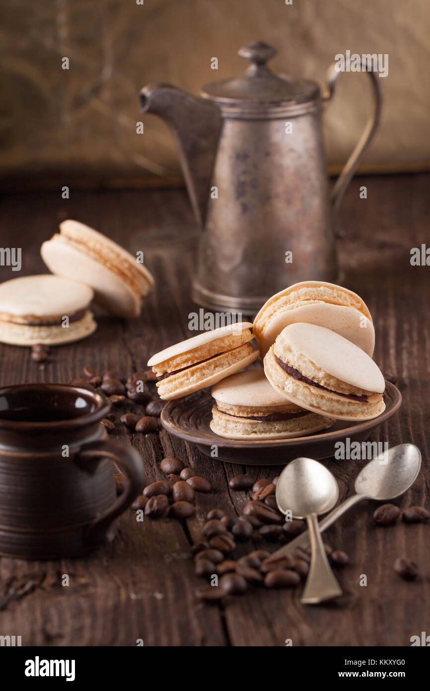 Homemade macaroons on ceramic plate with silver spoon, old silver ...
