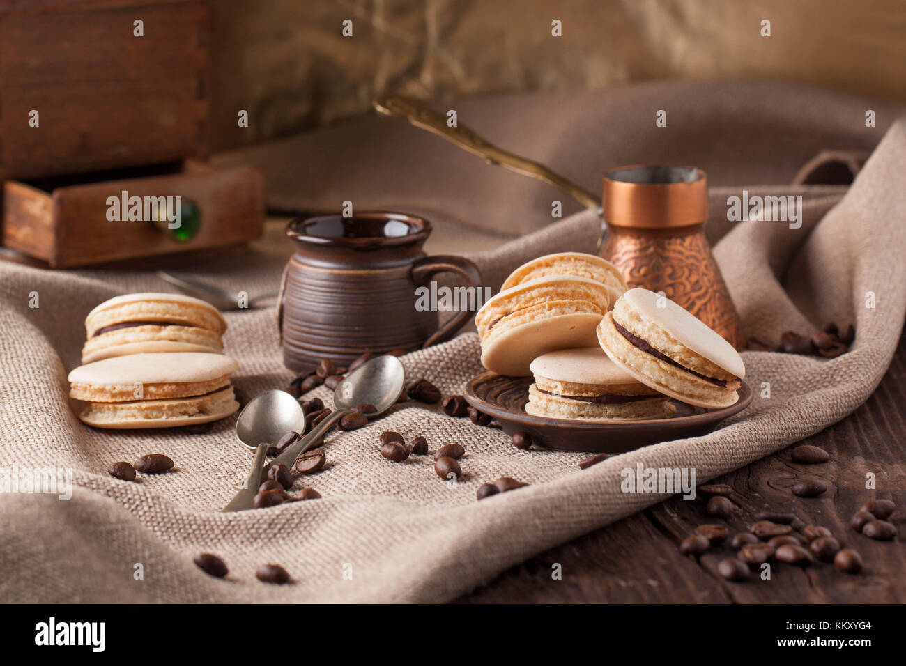 Homemade macaroons on ceramic plate with silver spoon, turk and ceramic ...