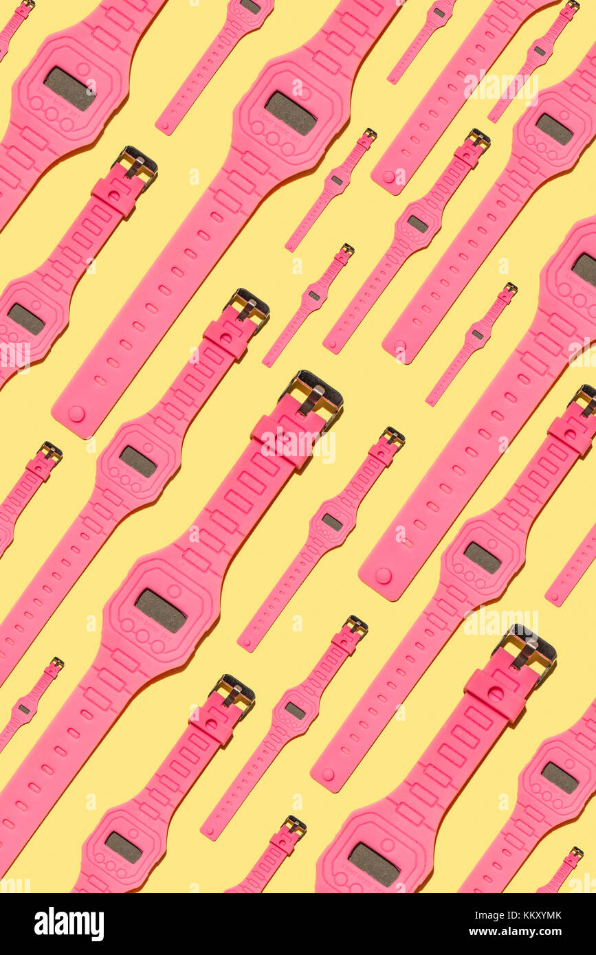 Bright colour hand pink clock pattern on yellow background Stock Photo ...