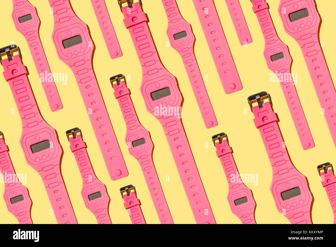 Bright colour hand pink clock pattern on yellow background Stock Photo ...