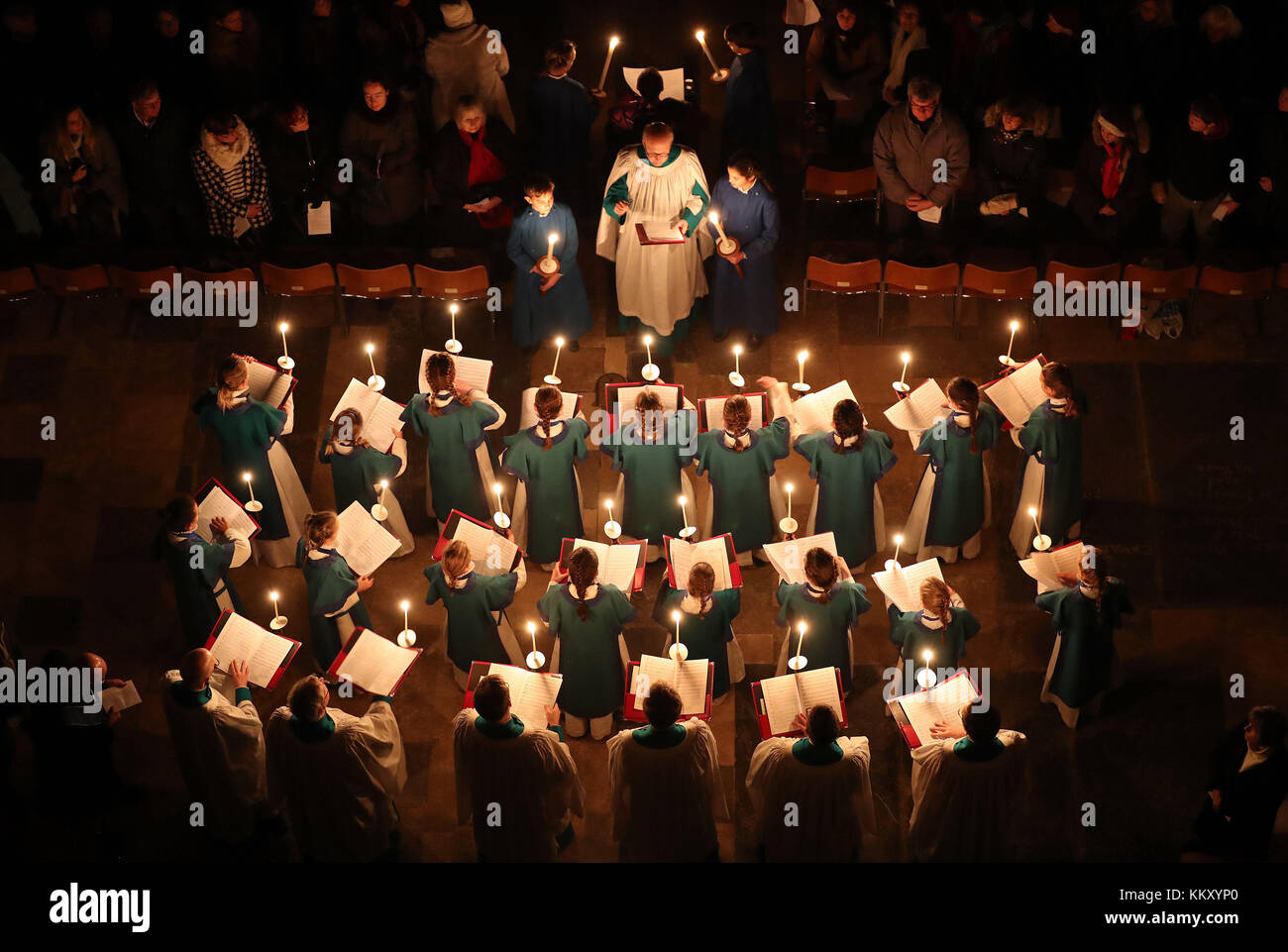 Choristers take part in a candle lit advent procession through ...