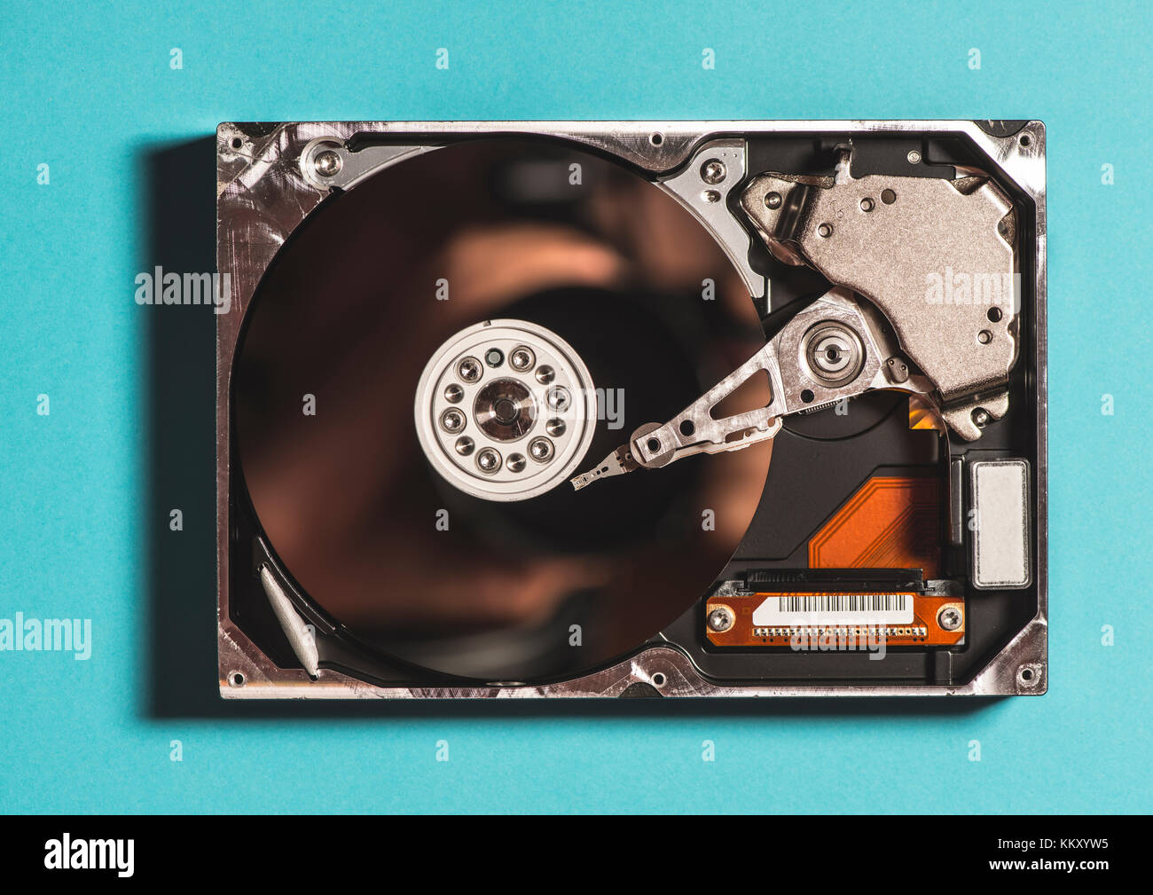 Open hard disc on blue background Stock Photo - Alamy