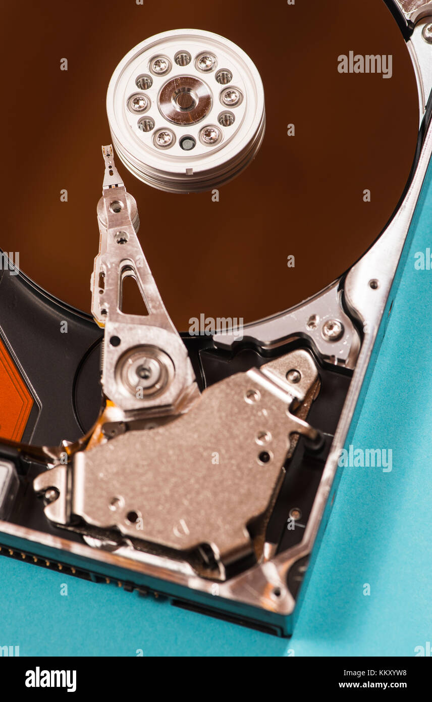 Open hard disc on blue background Stock Photo - Alamy