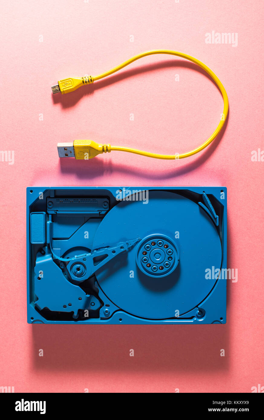 Blue colour hard disc and yellow USB cable Stock Photo - Alamy