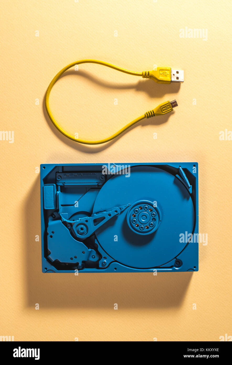 Blue colour hard disc and yellow USB cable Stock Photo - Alamy