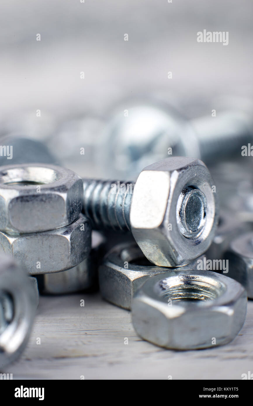 Metal nuts and bolts background. Macro. Working tools. Fixing elements Stock Photo - Alamy