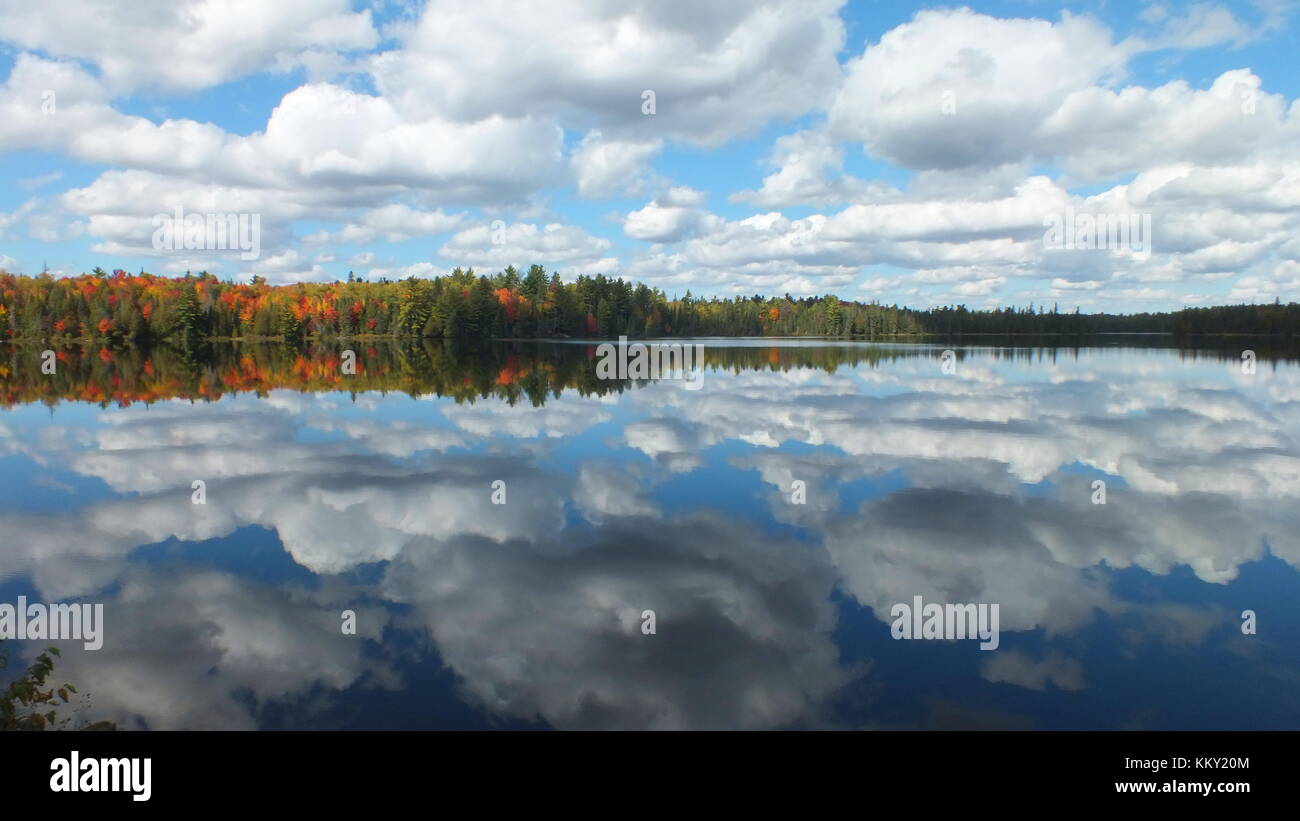 Dramatic cloud reflecttion on water Stock Photo - Alamy