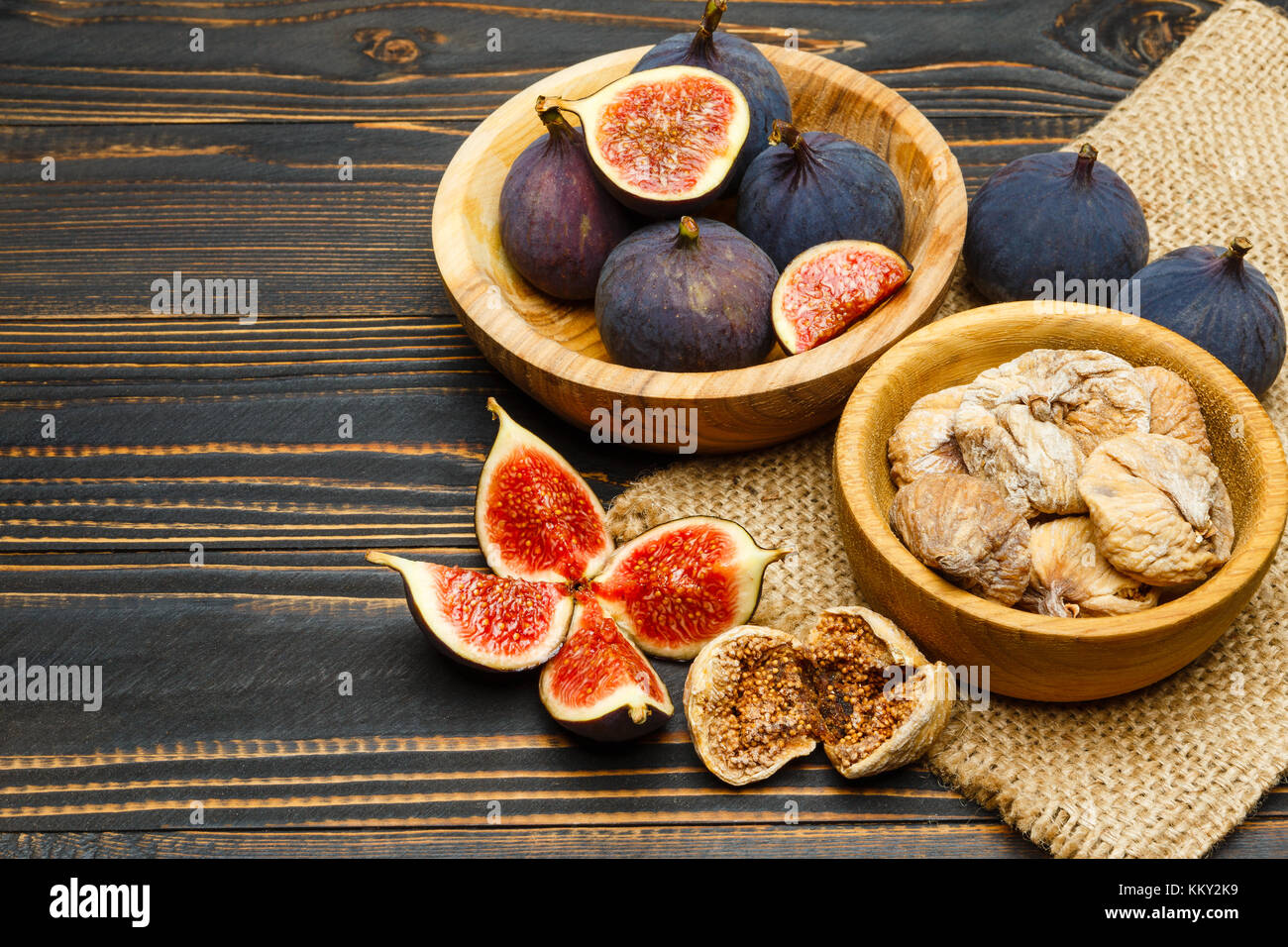 Fresh and dried Fig isolated on wooden background Stock Photo - Alamy