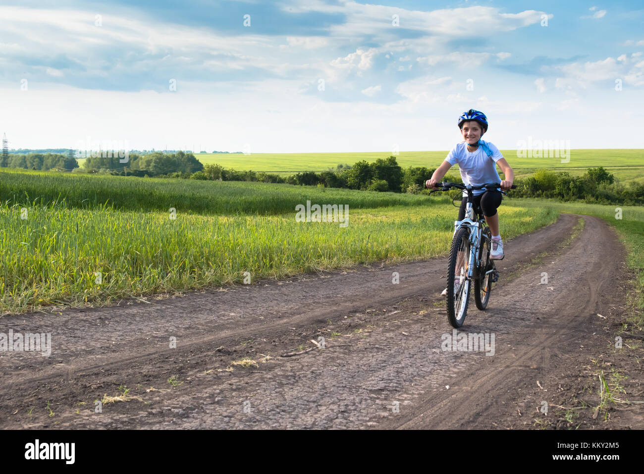 girl on a bicycle in summer rural landscape Stock Photo - Alamy