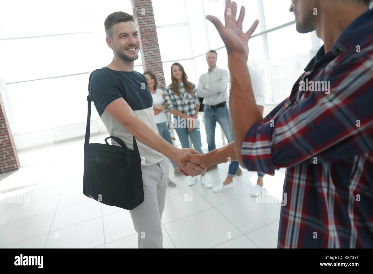handshake between the designer and the client Stock Photo - Alamy