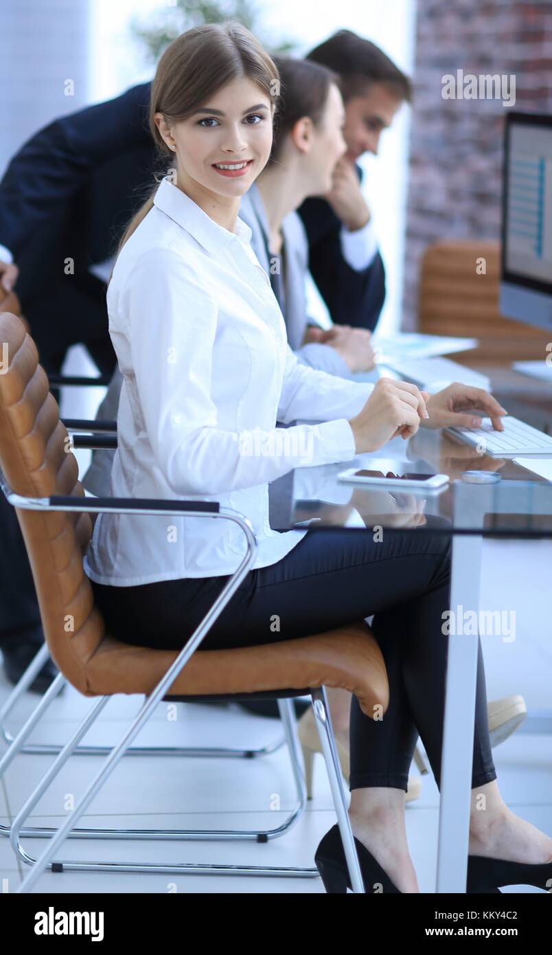 young employee sitting at a Desk Stock Photo - Alamy