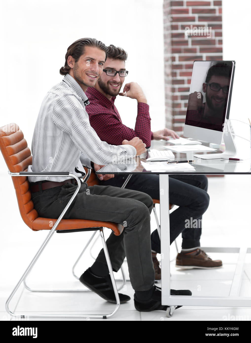 business colleagues sitting at a Desk Stock Photo - Alamy