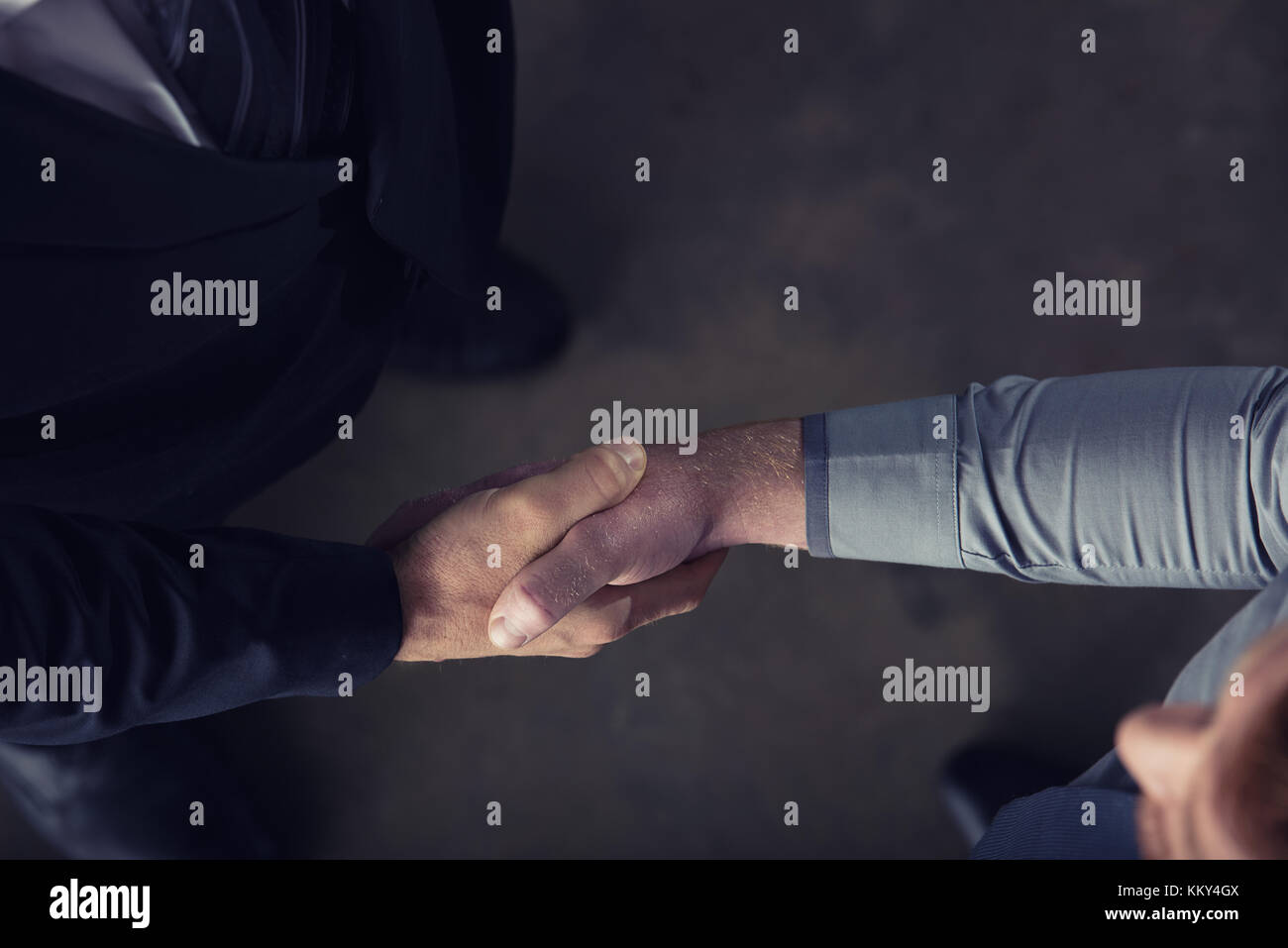 Handshaking business person in office. concept of teamwork and ...