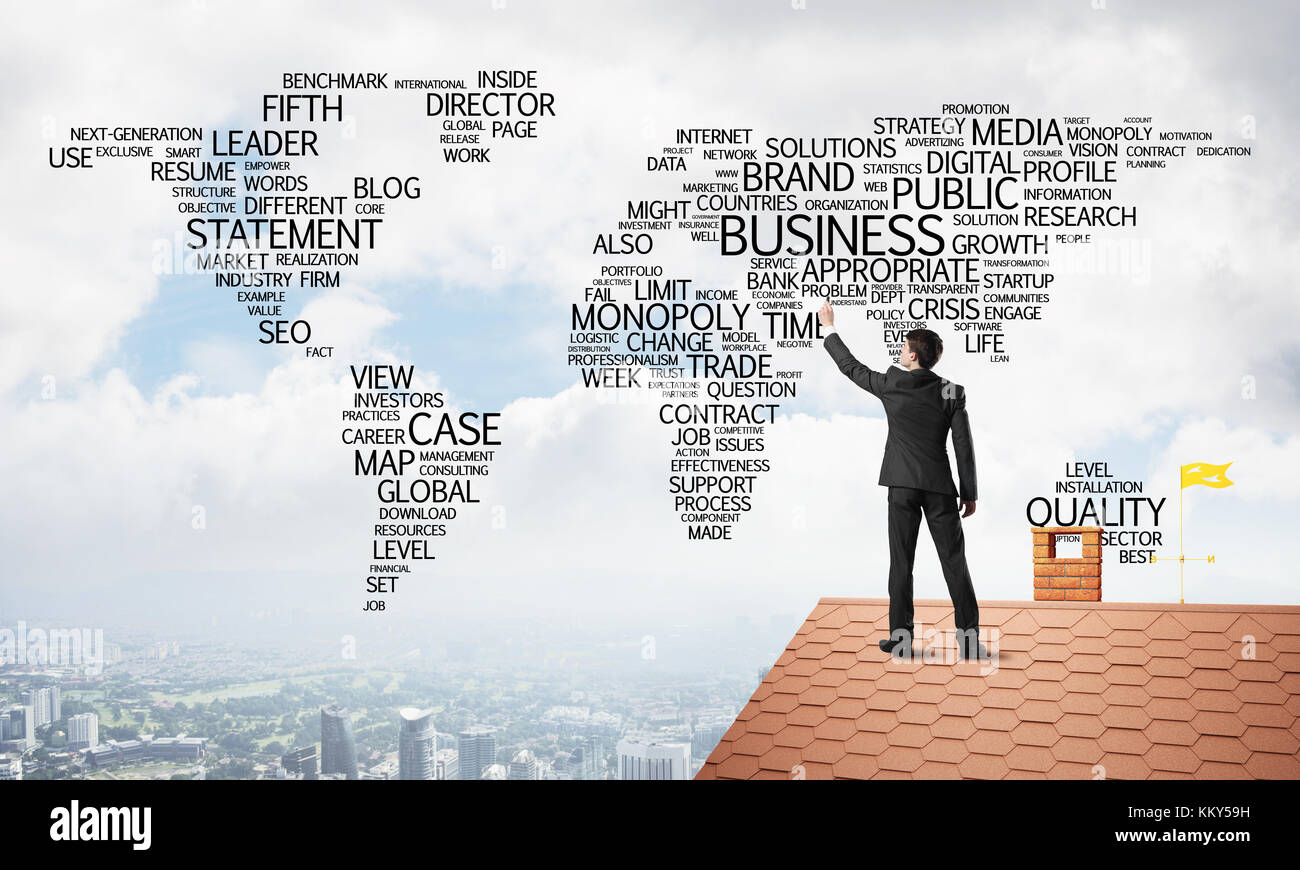 Businessman on brick roof draw world map as concept of globalization ...