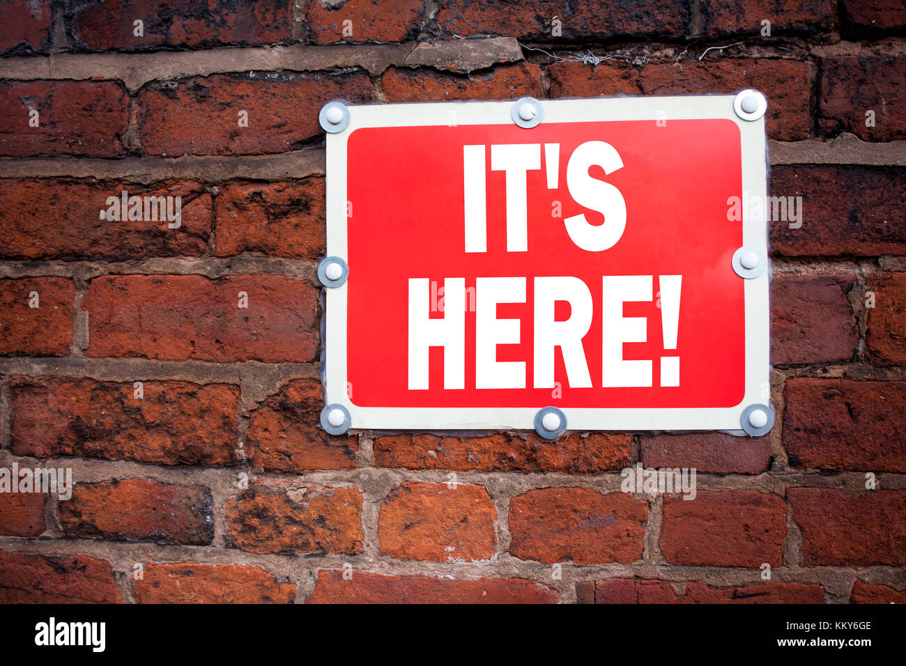 Hand writing text caption inspiration showing It's Here concept meaning ...