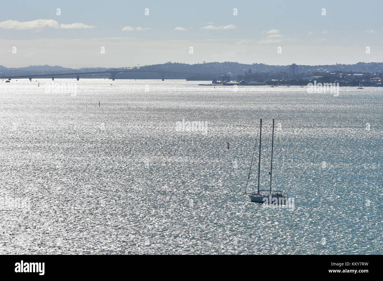 Sail ship with two masts sailing in Auckland with Devonport and Harbour ...