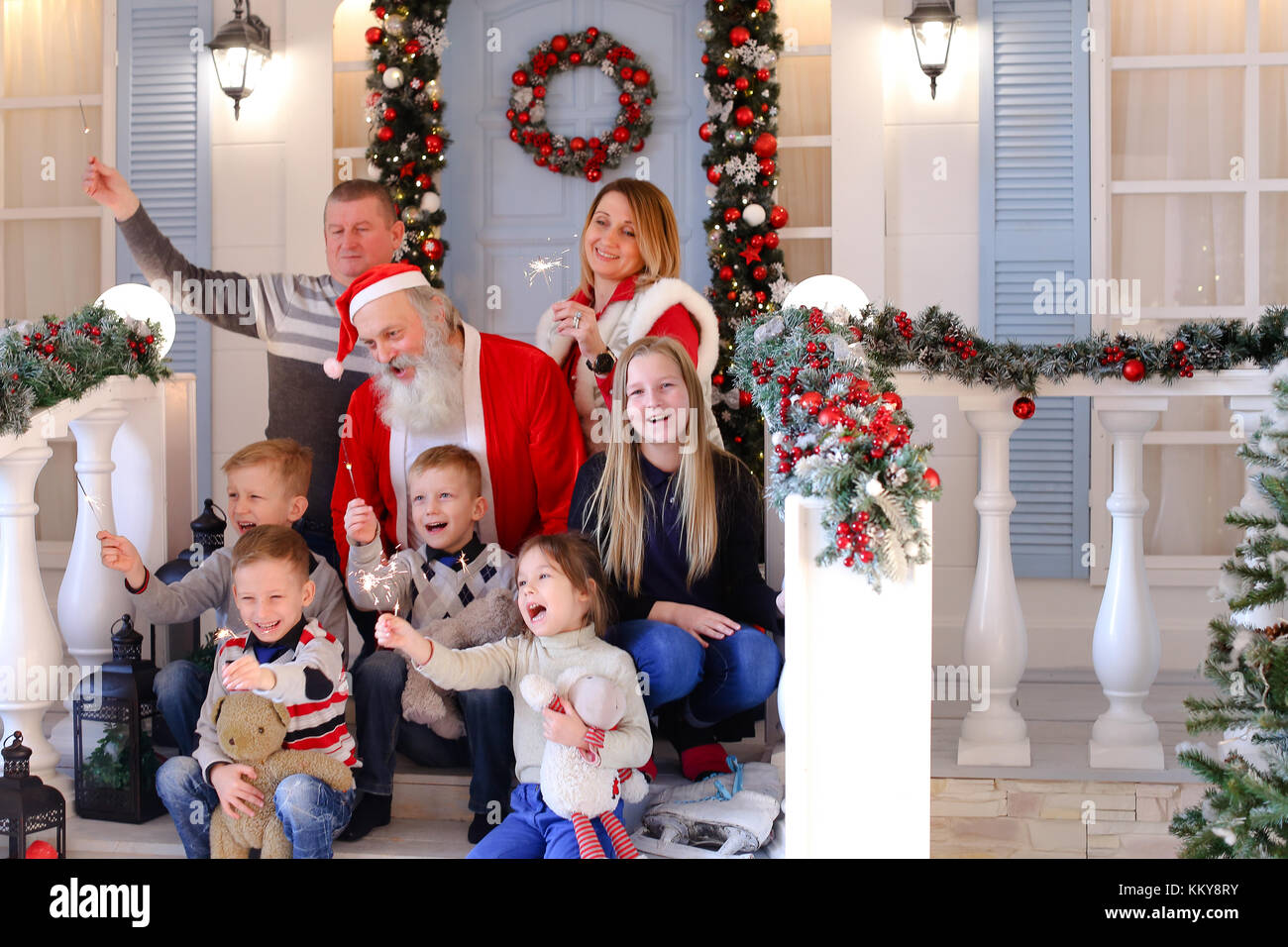 large European family with father Christmas looking forward to New Year ...