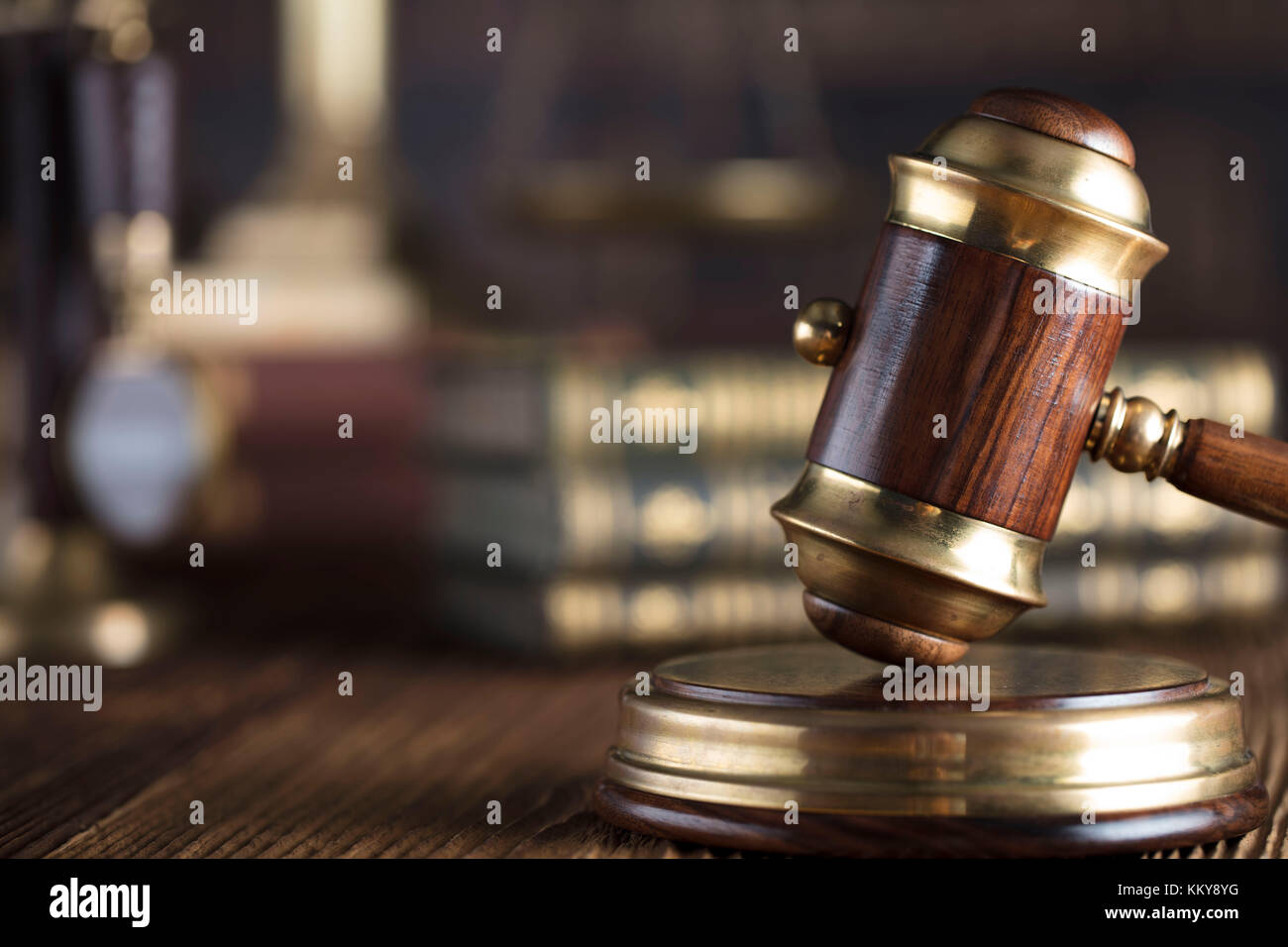 Beautiful antique gavel made of wood and brass. Law symbols composition ...