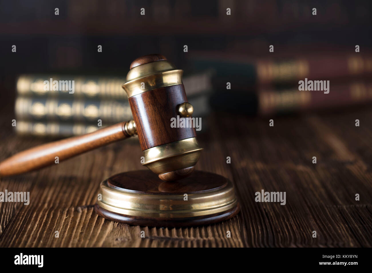 Beautiful antique gavel made of wood and brass. Law symbols composition ...