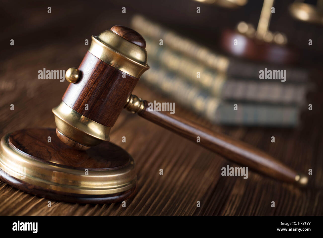Beautiful antique gavel made of wood and brass. Law symbols composition ...