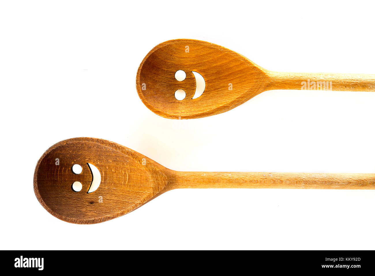 Wooden smiley face spoons on a white background. Studio shot. Set of ...
