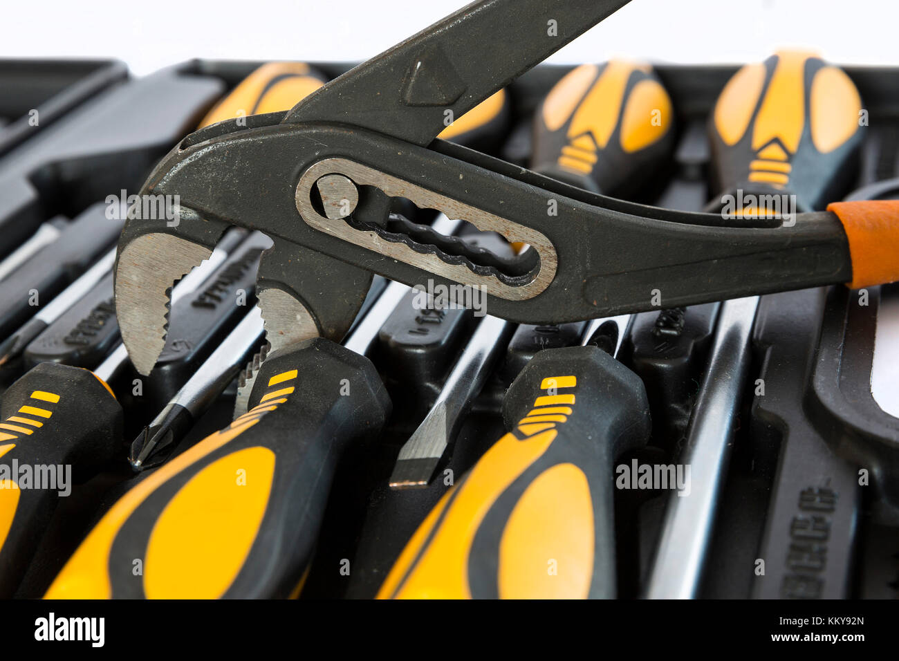 Set of screwdrivers and Adjustable pliers in a box with rubber black ...