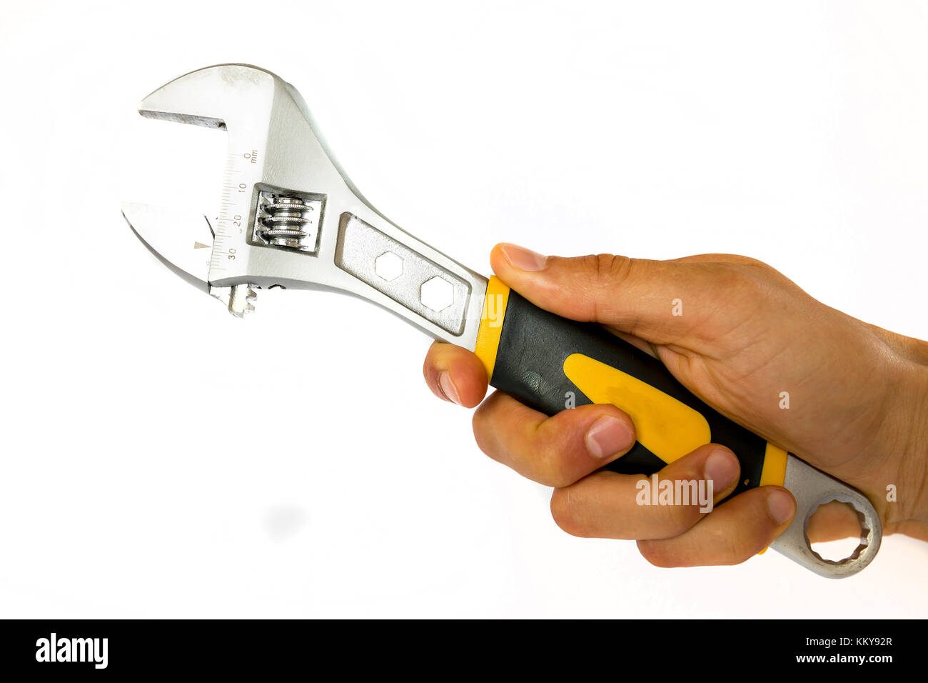 Adjustable Wrench isolated on a white background. Hold by a human hand ...