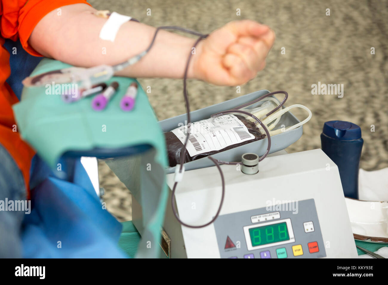 The hand of a woman who donates blood. Female donor gives blood in a ...