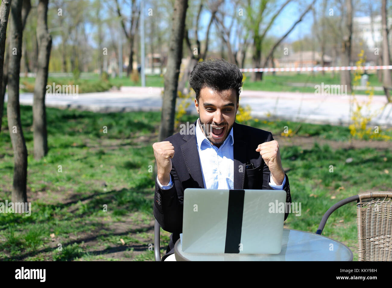 Person using laptop and clicking keyboard, putting hands up, close ...