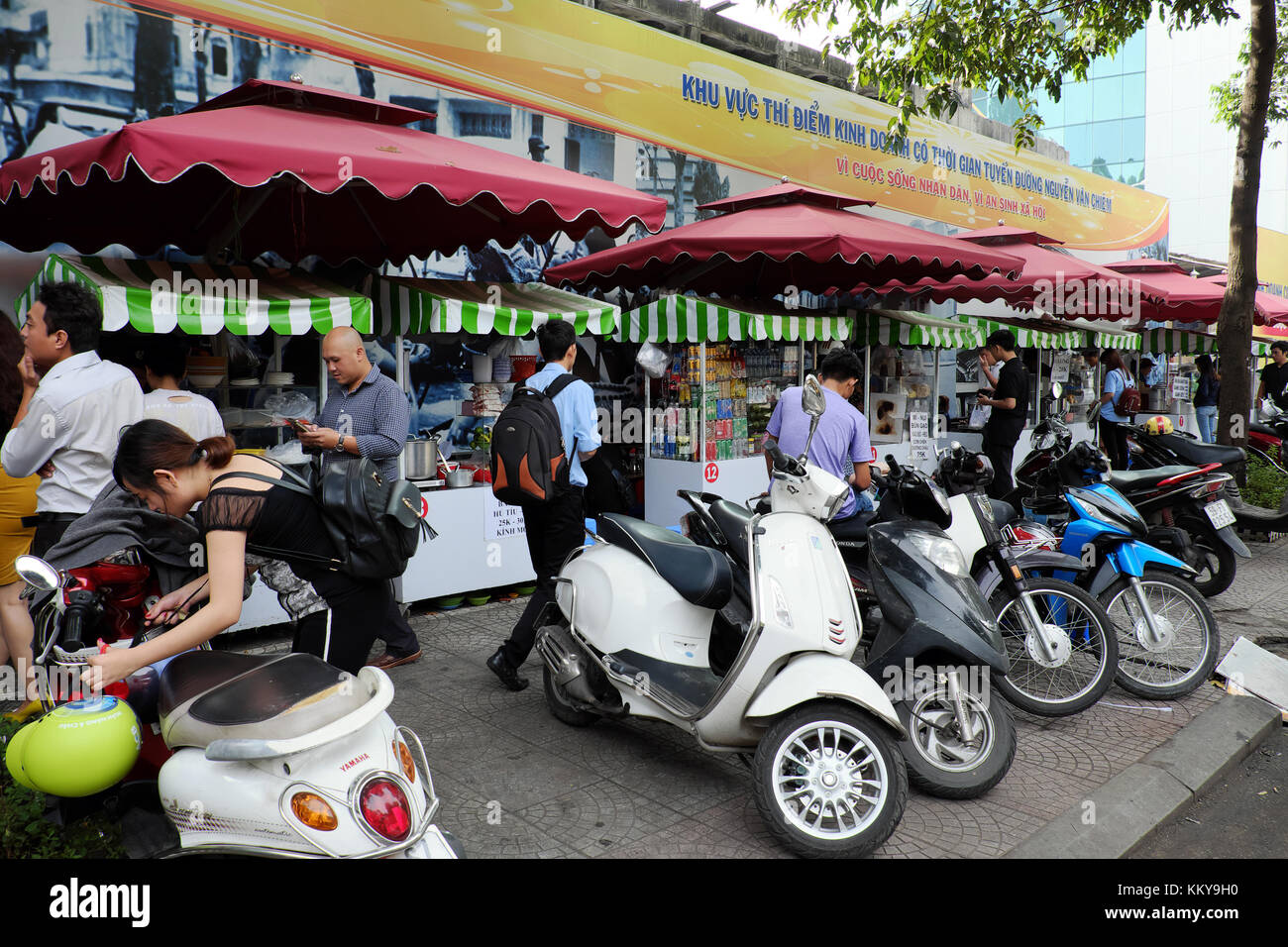 HO CHI MINH CITY, VIET NAM- DEC 1, 2017: Group of food cart on pavement ...
