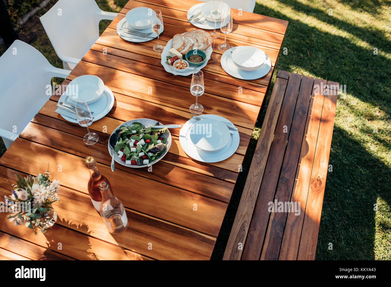 Top view of food on wooden table for housewarming party. Table outdoors ...