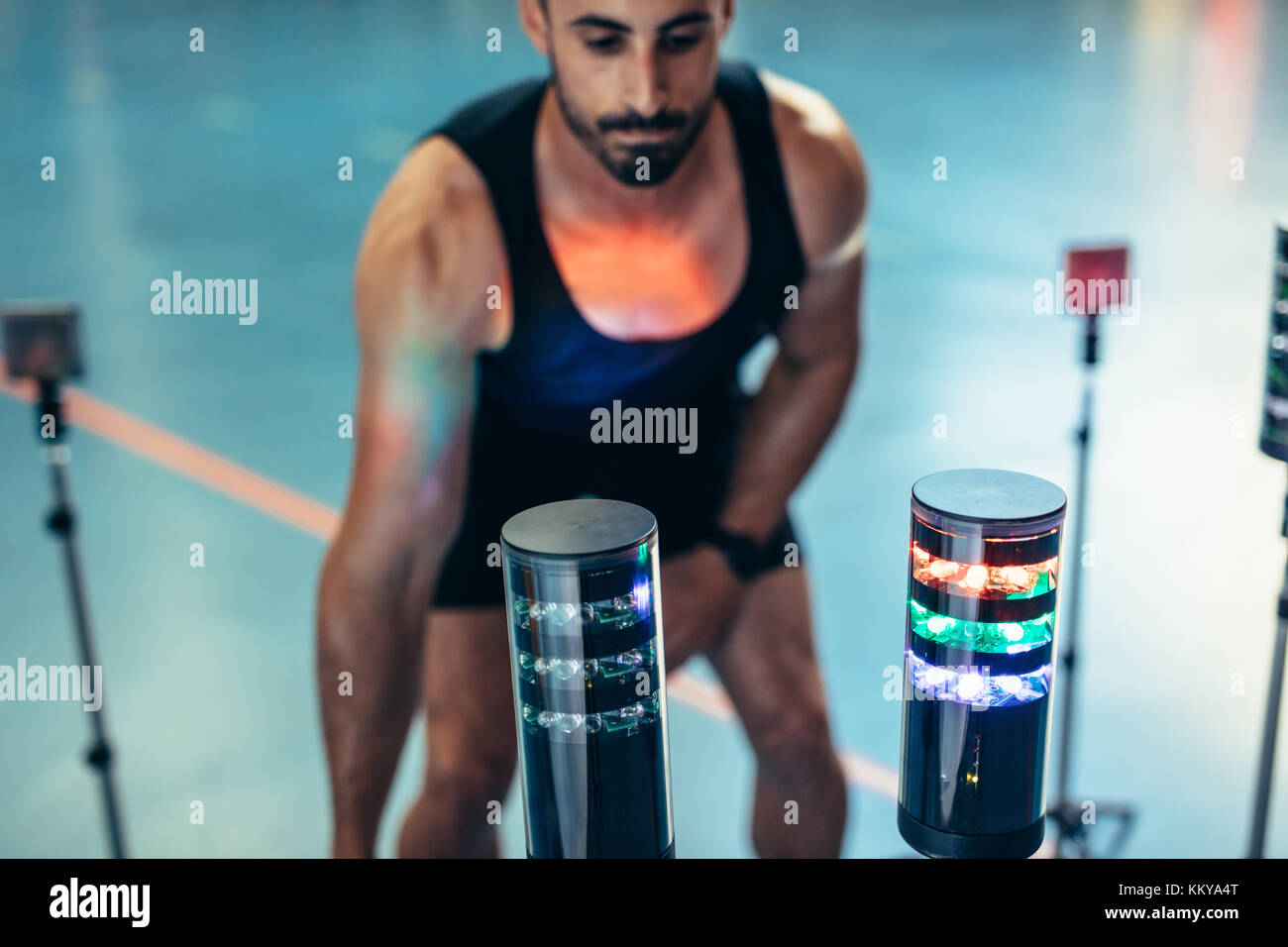 Sportsman exercising with lights around, reaction training session at ...