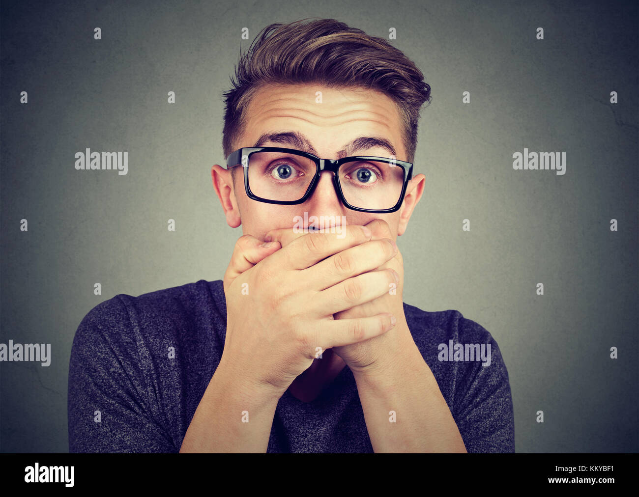 Man covering his mouth hi-res stock photography and images - Alamy