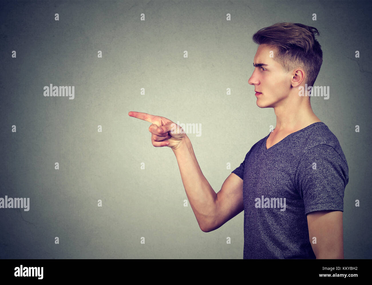 Serious suspicious man pointing finger at someone Stock Photo - Alamy