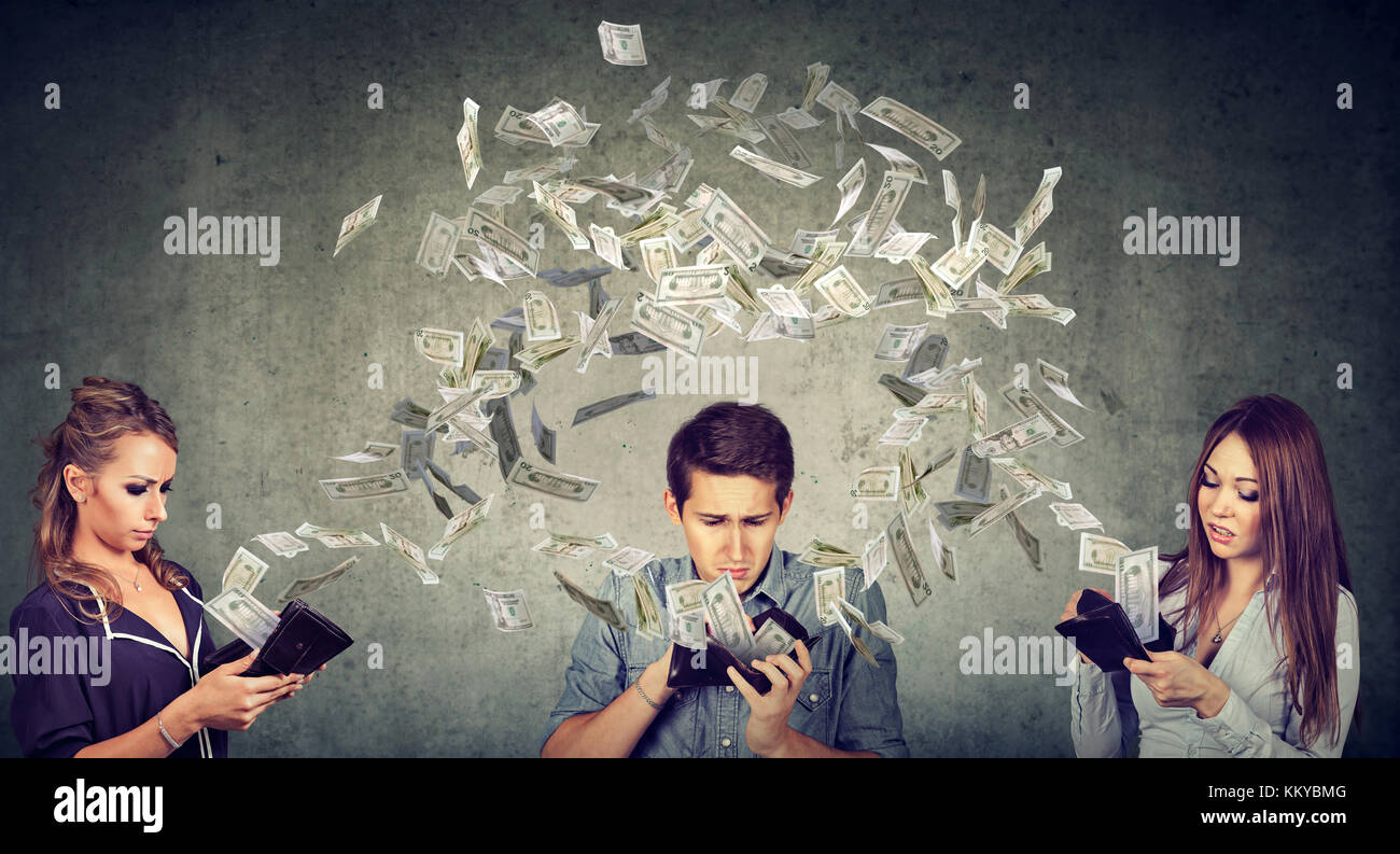 Worried sad man and two women looking at their wallets with money ...